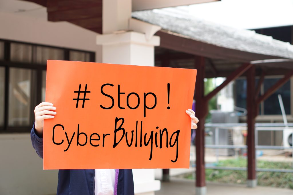 Text,Stop,Cyber,Bullying,On,Paper,Sign,Held,By,Asian – INTI ...
